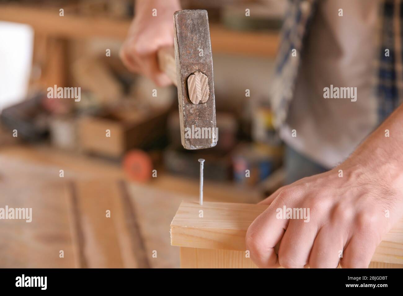 Man driving nail hi-res stock photography and images - Alamy