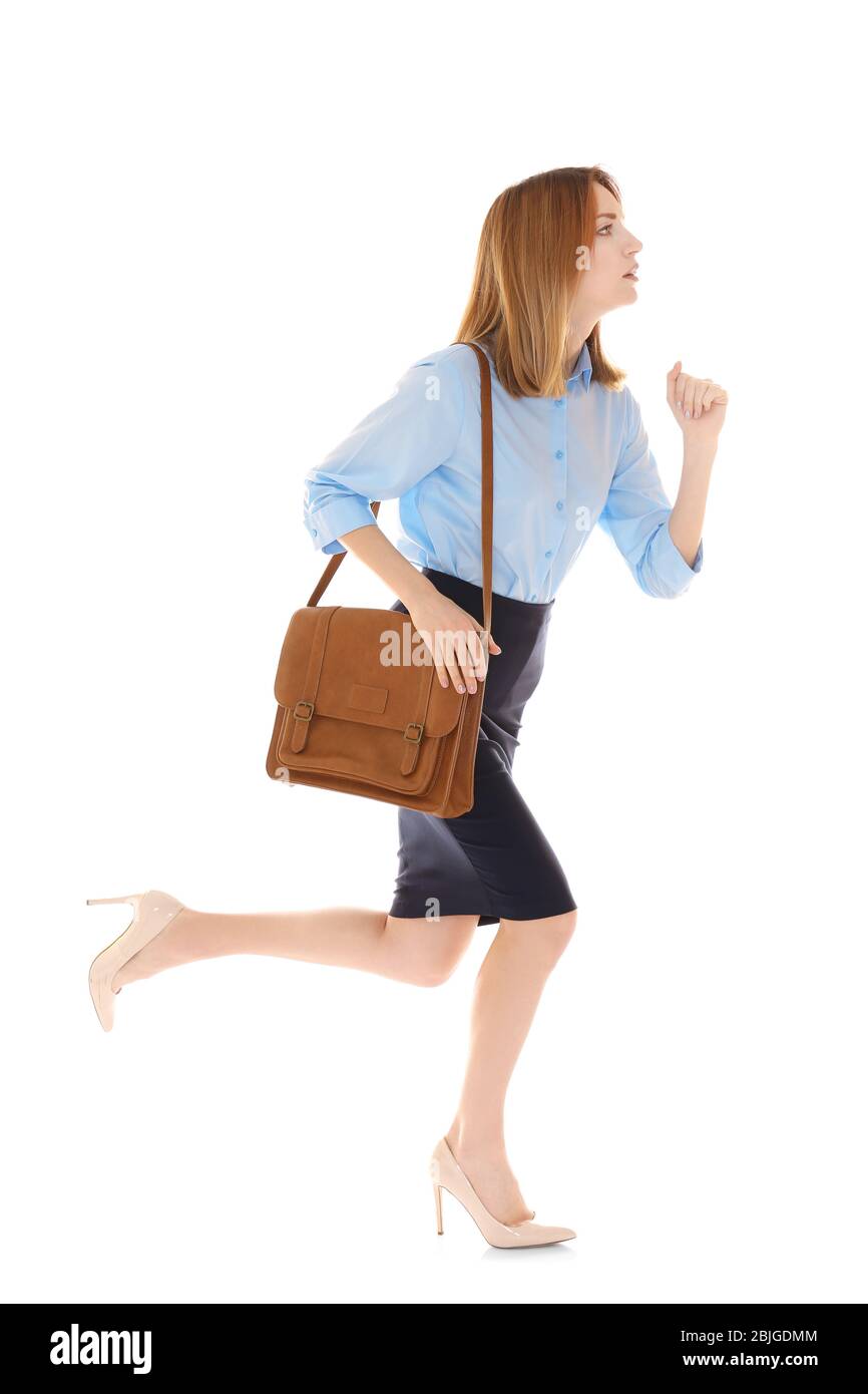 Young businesswoman running on white background Stock Photo - Alamy