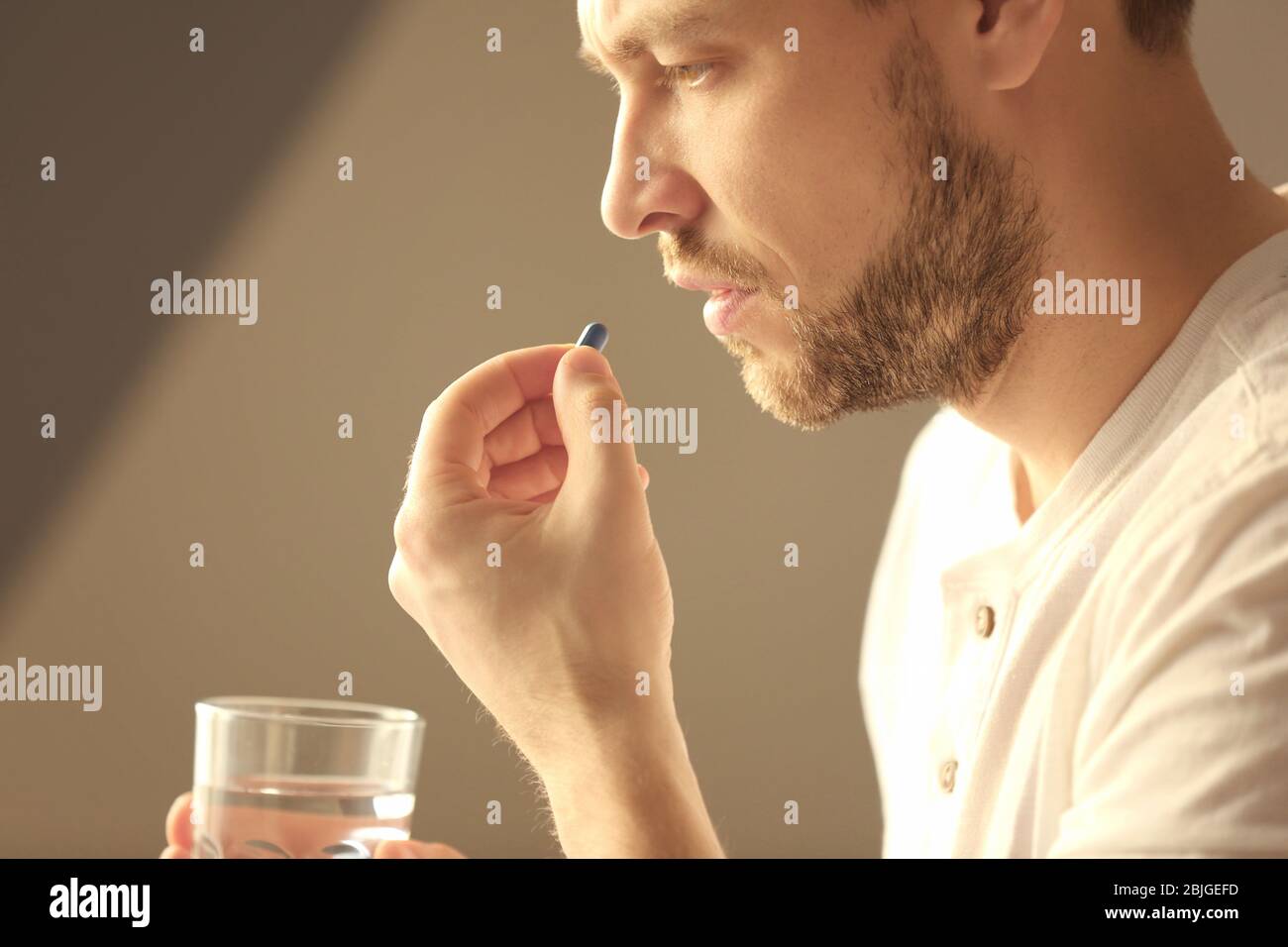 Sick handsome young man taking hi-res stock photography and images - Alamy
