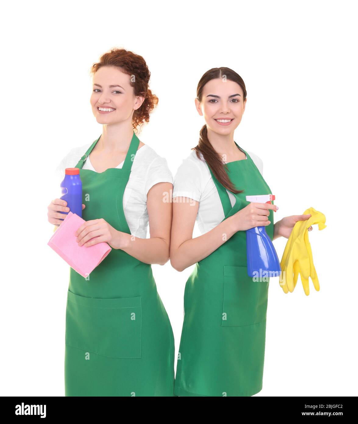 Cleaning staff in green aprons on white background Stock Photo - Alamy