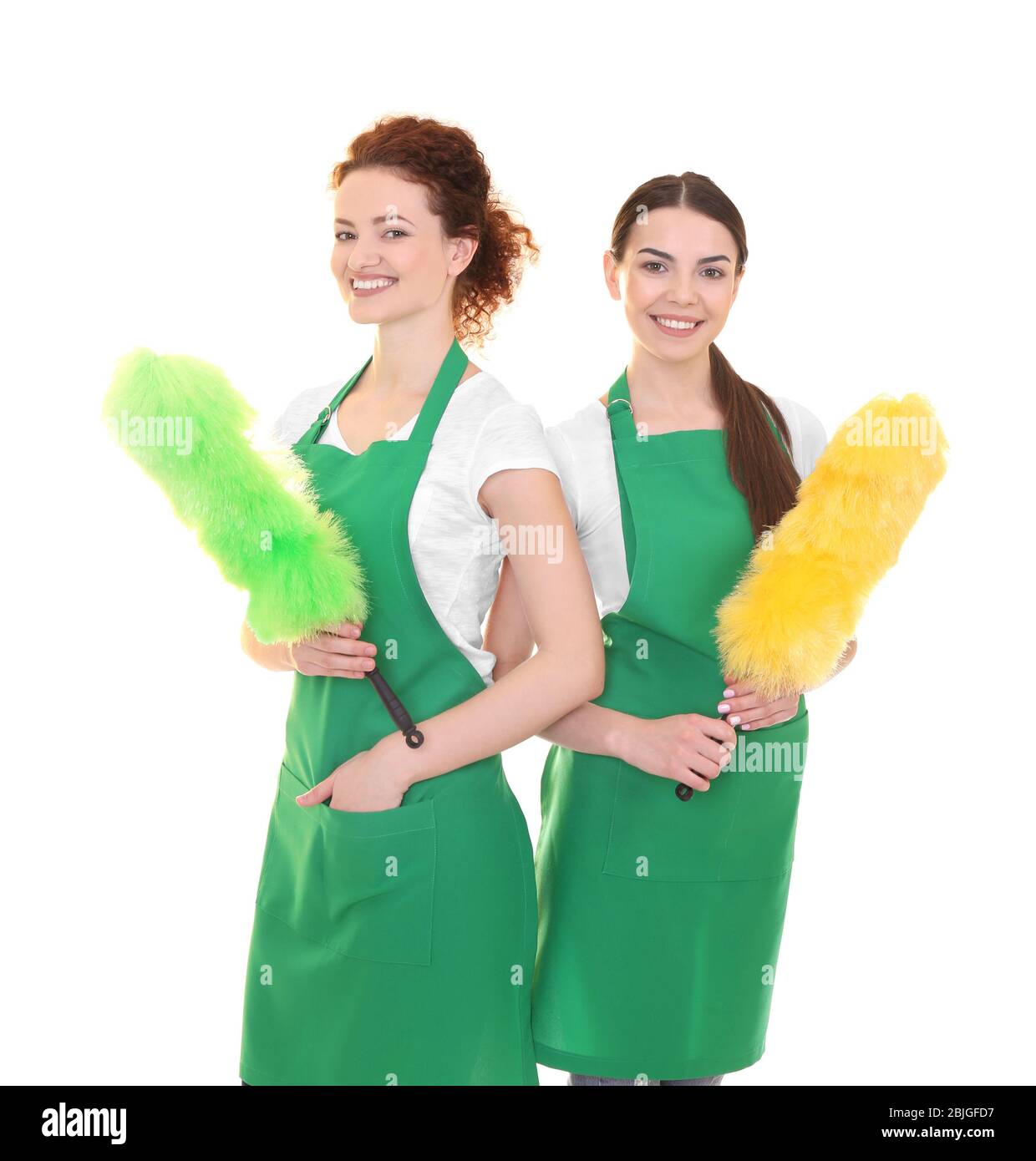 Cleaning staff in green aprons on white background Stock Photo - Alamy