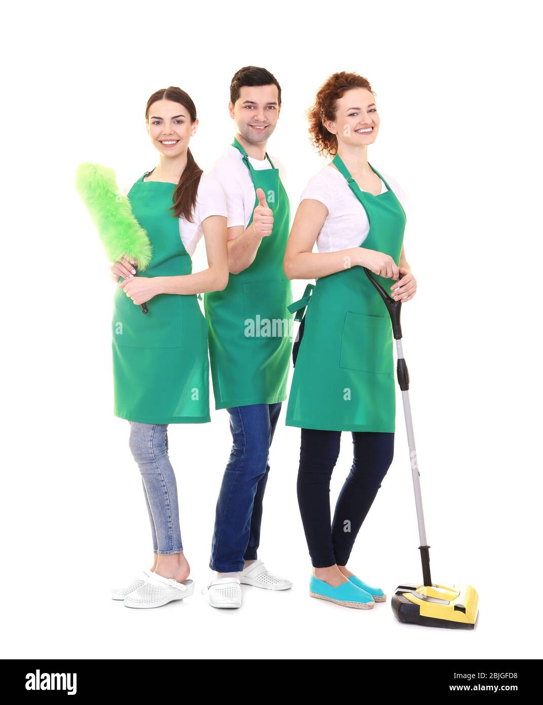 Cleaning staff in green aprons on white background Stock Photo - Alamy