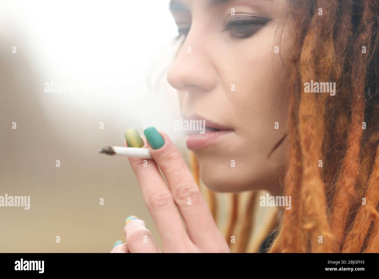 Woman smoking hashish hi-res stock photography and images - Alamy