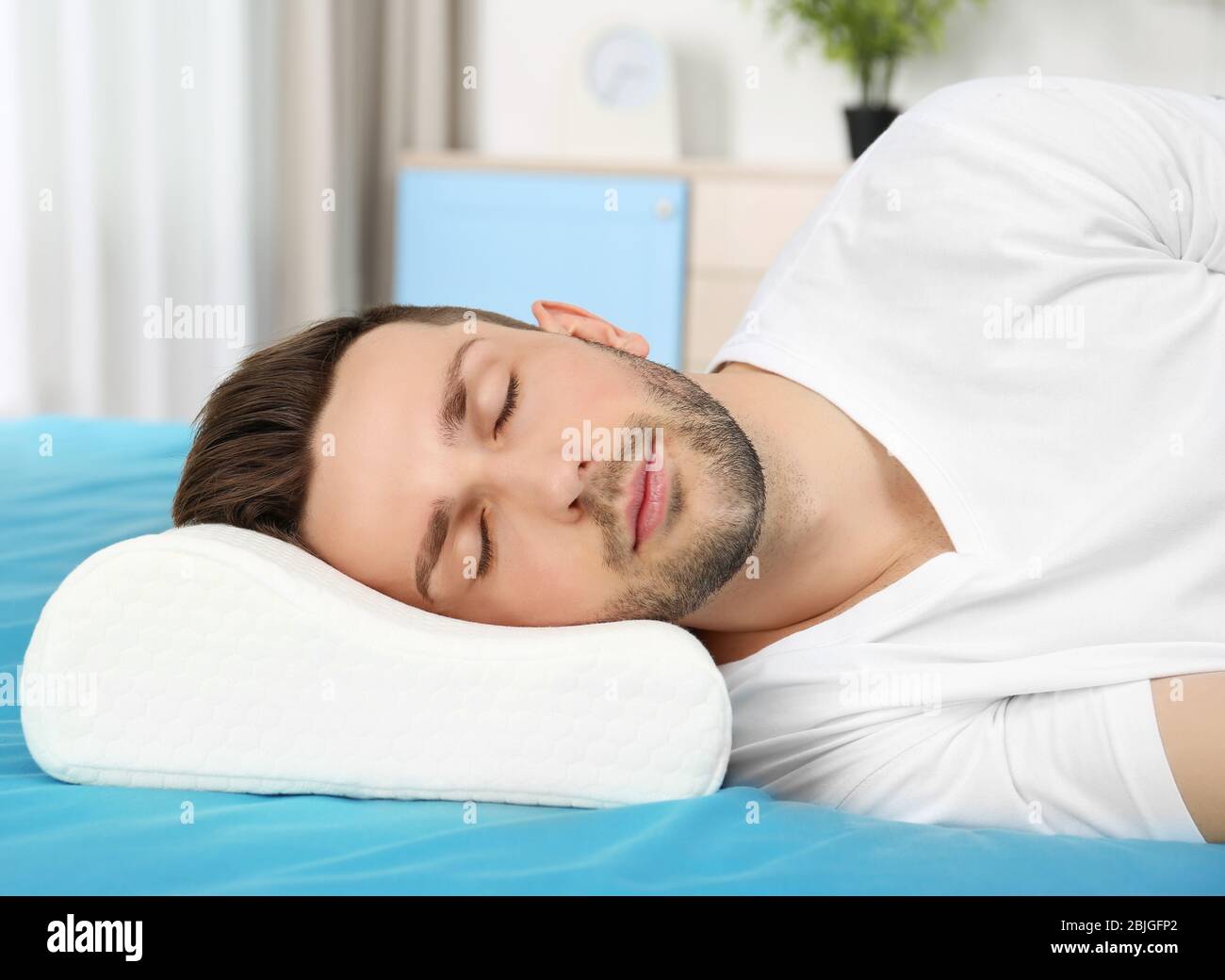 Man sleeping on orthopedic pillow hi-res stock photography and images ...