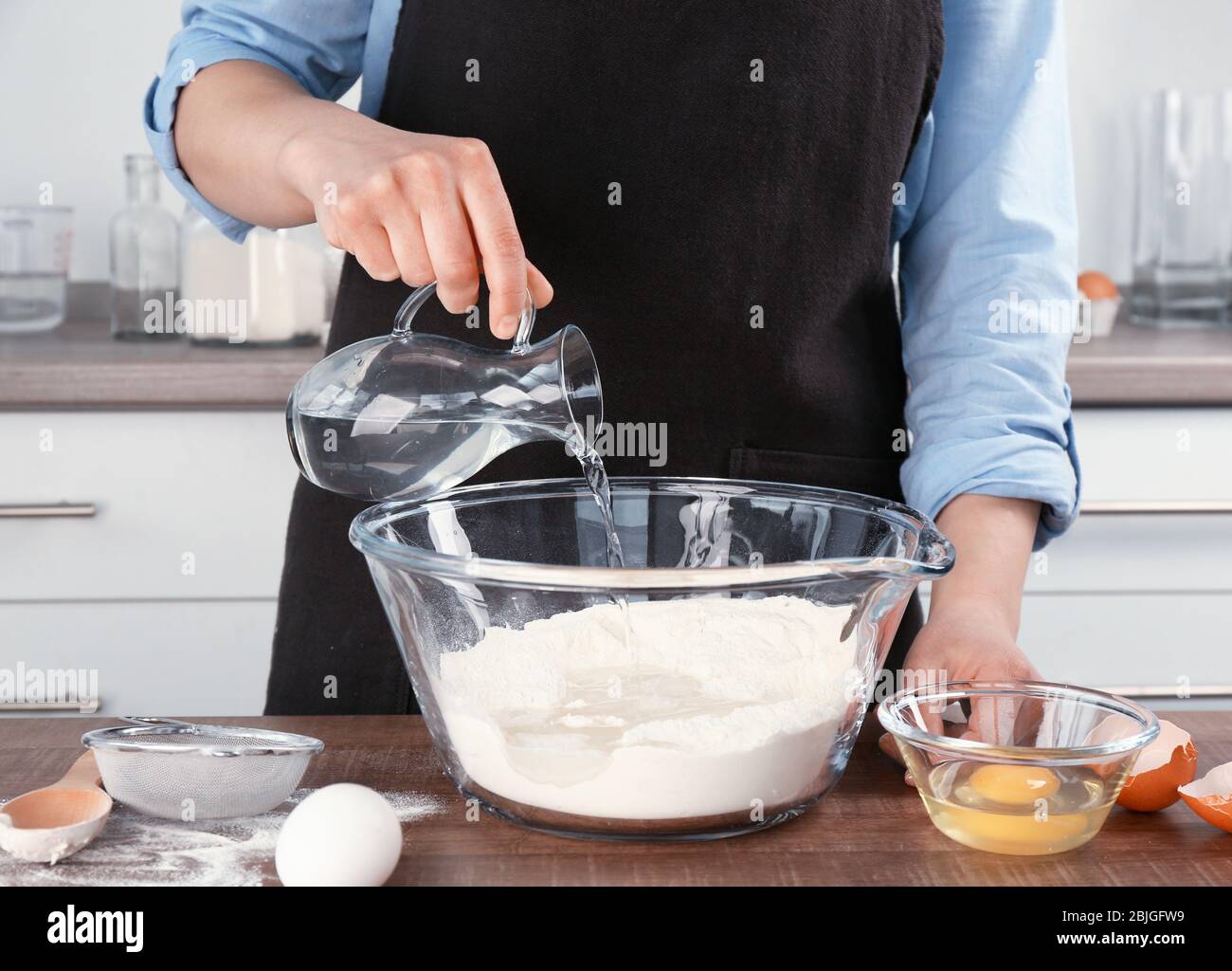 Chef pouring water dough bread hi-res stock photography and images - Alamy