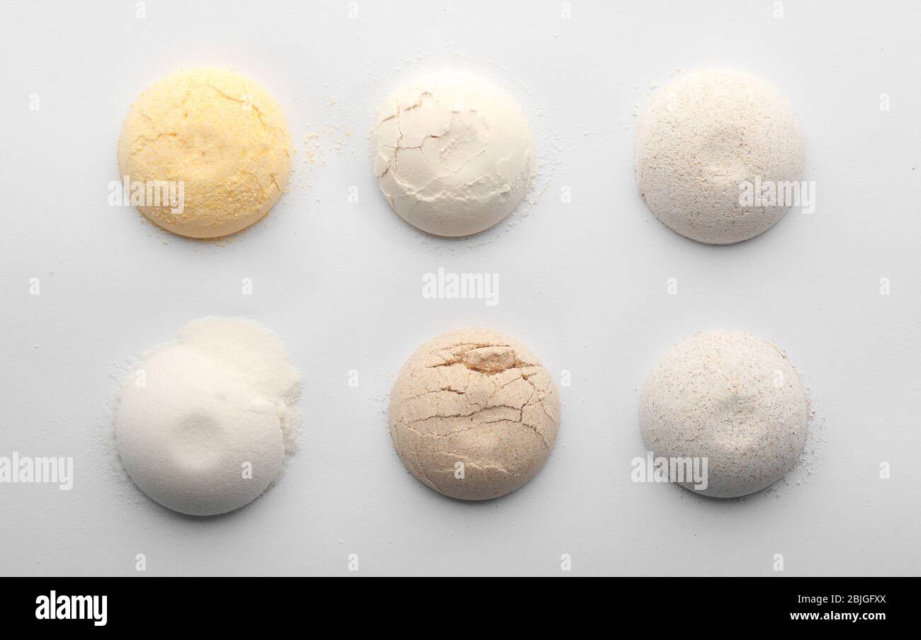 Different types of flour on white background Stock Photo - Alamy