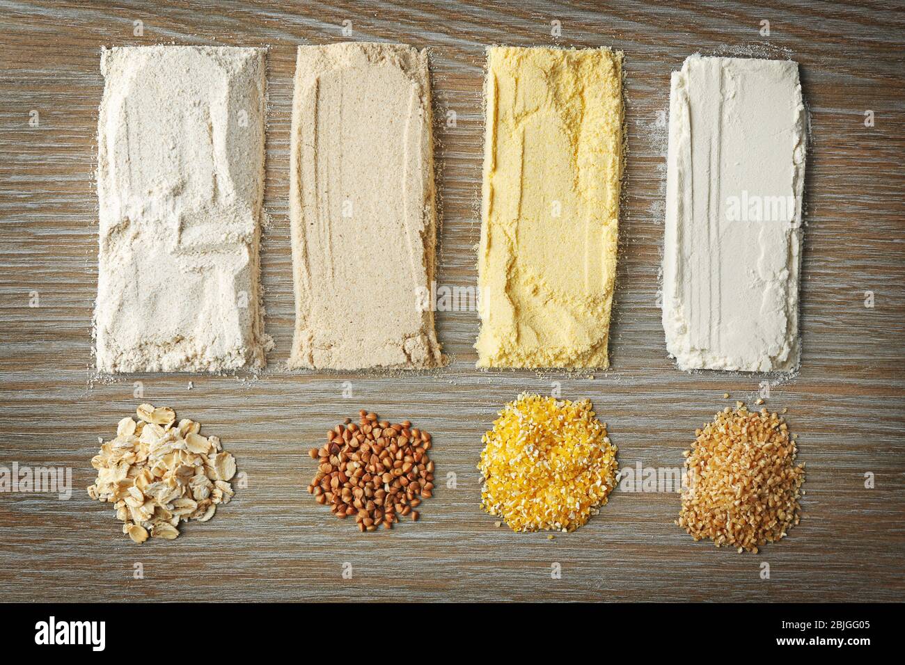 Composition with different types of flour on wooden table Stock Photo ...