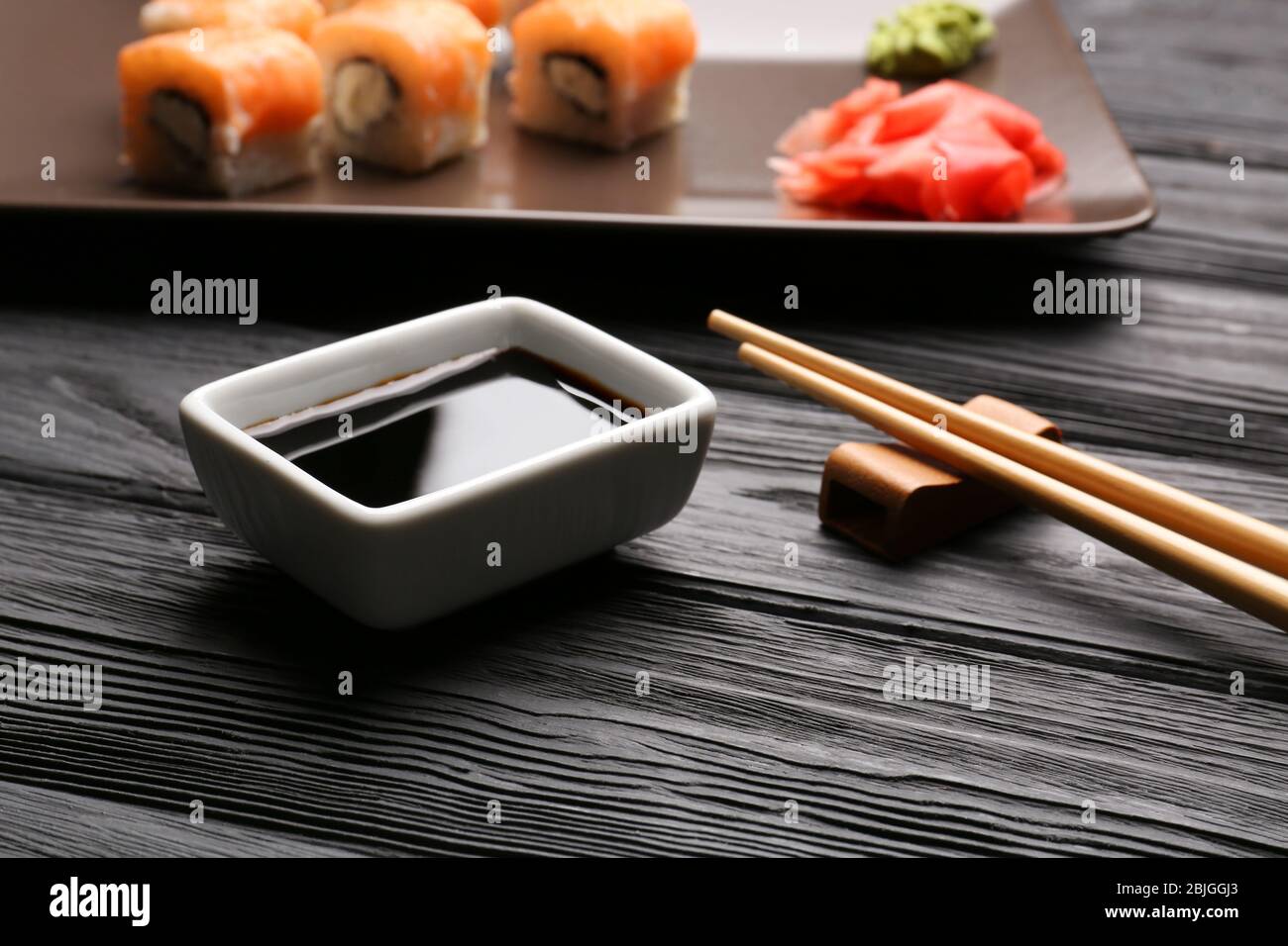 Composition with tasty soy sauce on wooden background Stock Photo - Alamy