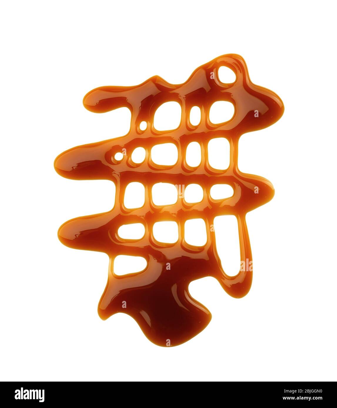 Tasty caramel sauce on white background Stock Photo - Alamy