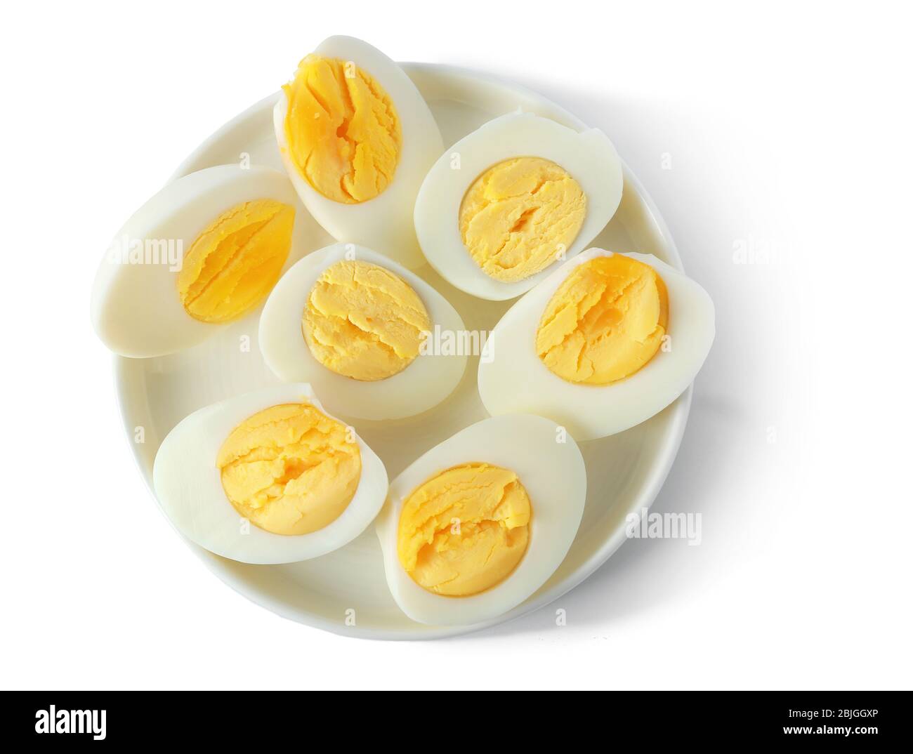 Ceramic tray with sliced hard boiled eggs on white background. Nutrition concept Stock Photo - Alamy