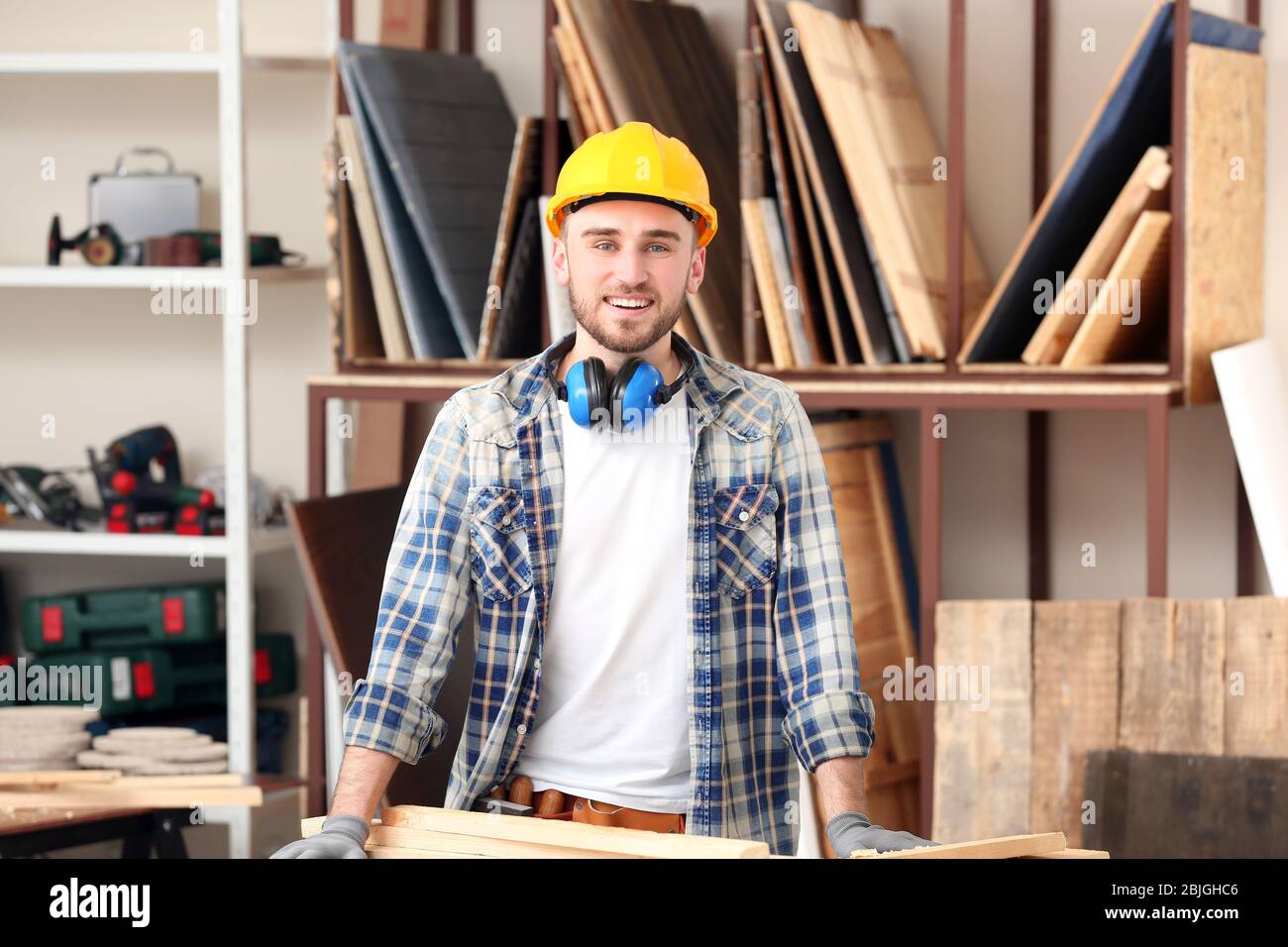 Handsome young carpenter boards hi-res stock photography and images - Alamy