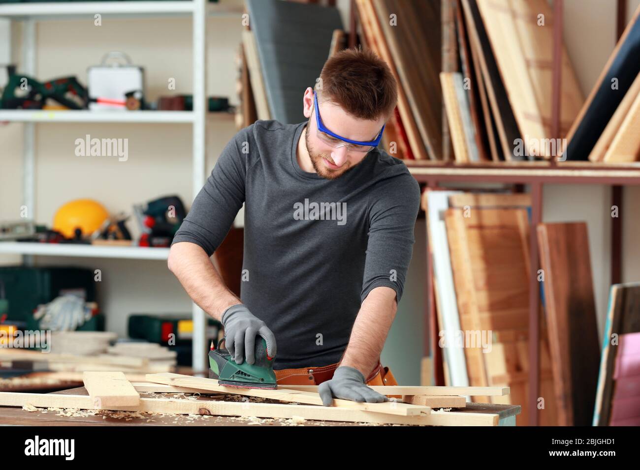 Handsome young carpenter in workshop Stock Photo - Alamy