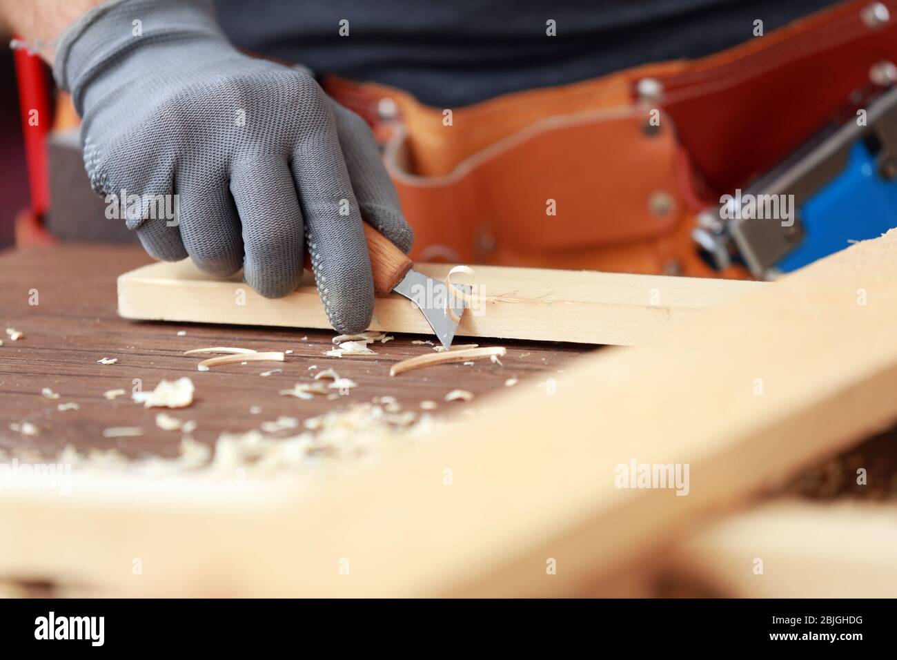 Hand of carpenter with cutter in workshop, closeup Stock Photo - Alamy