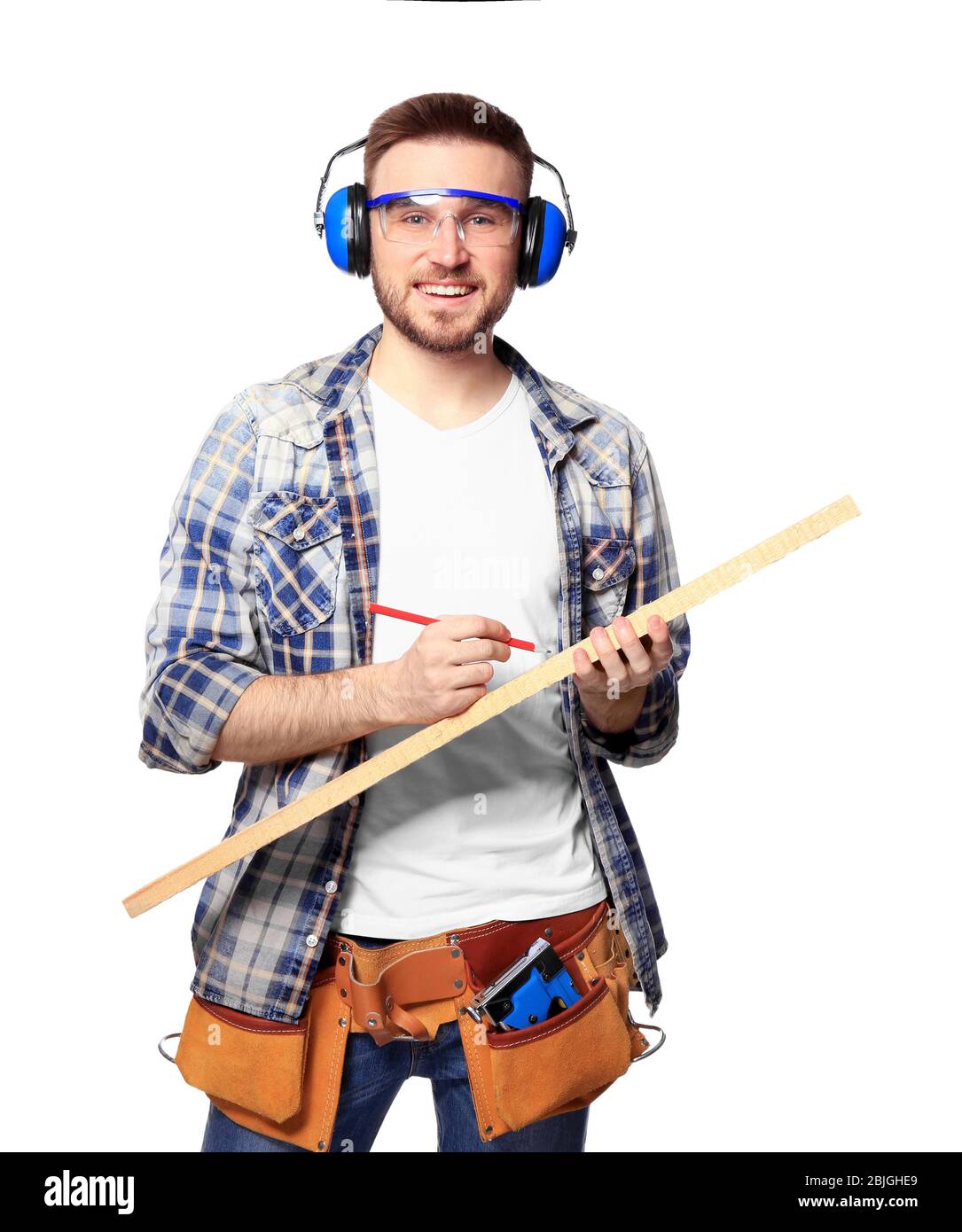 Handsome young carpenter on white background Stock Photo - Alamy