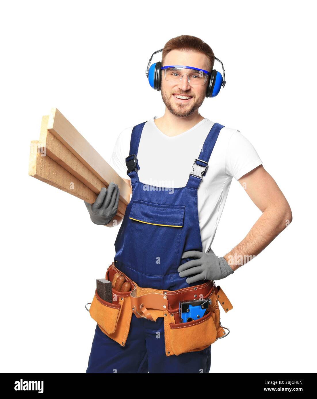 Handsome young carpenter on white background Stock Photo - Alamy