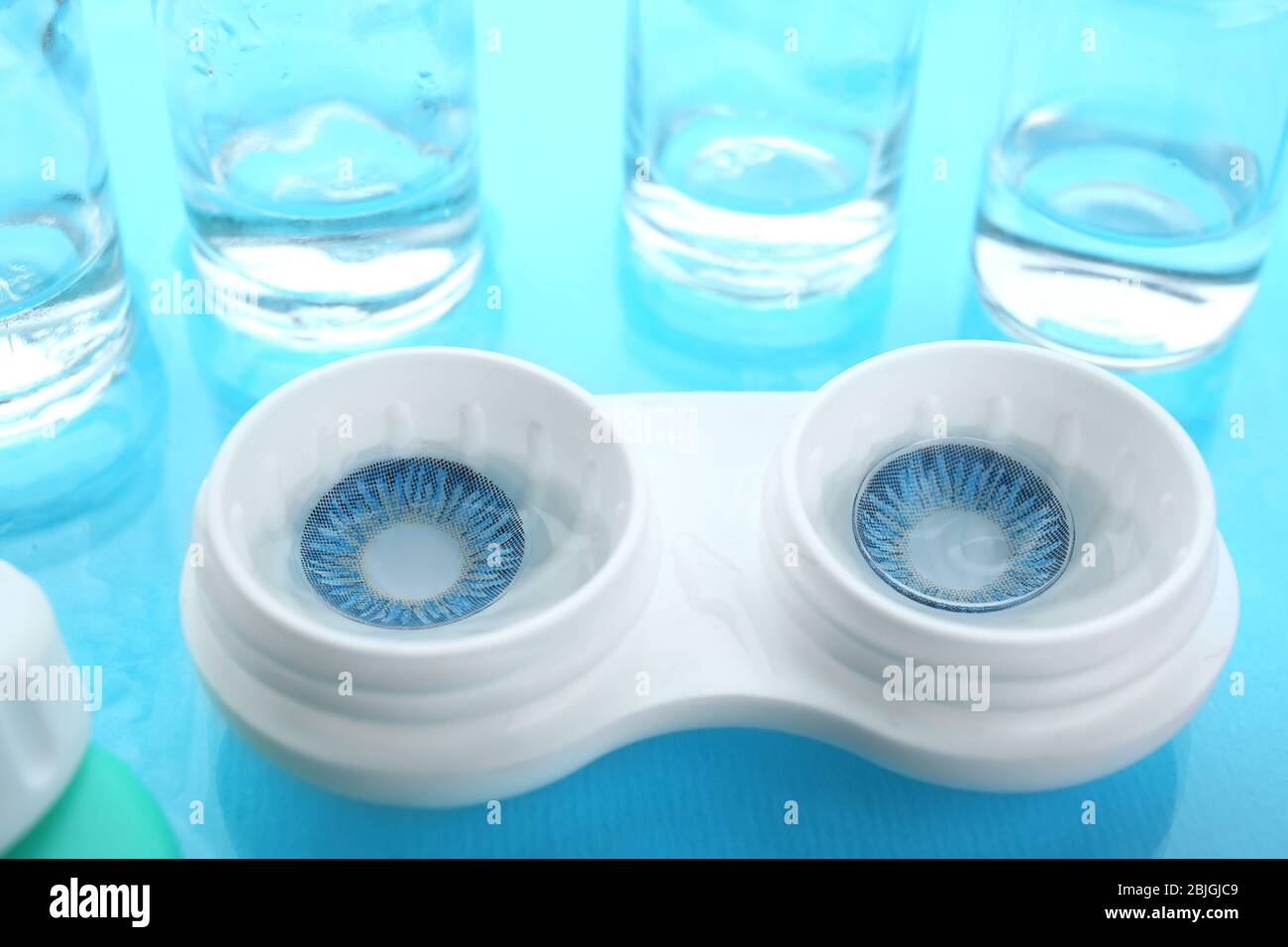 Container with color contact lenses on table Stock Photo - Alamy