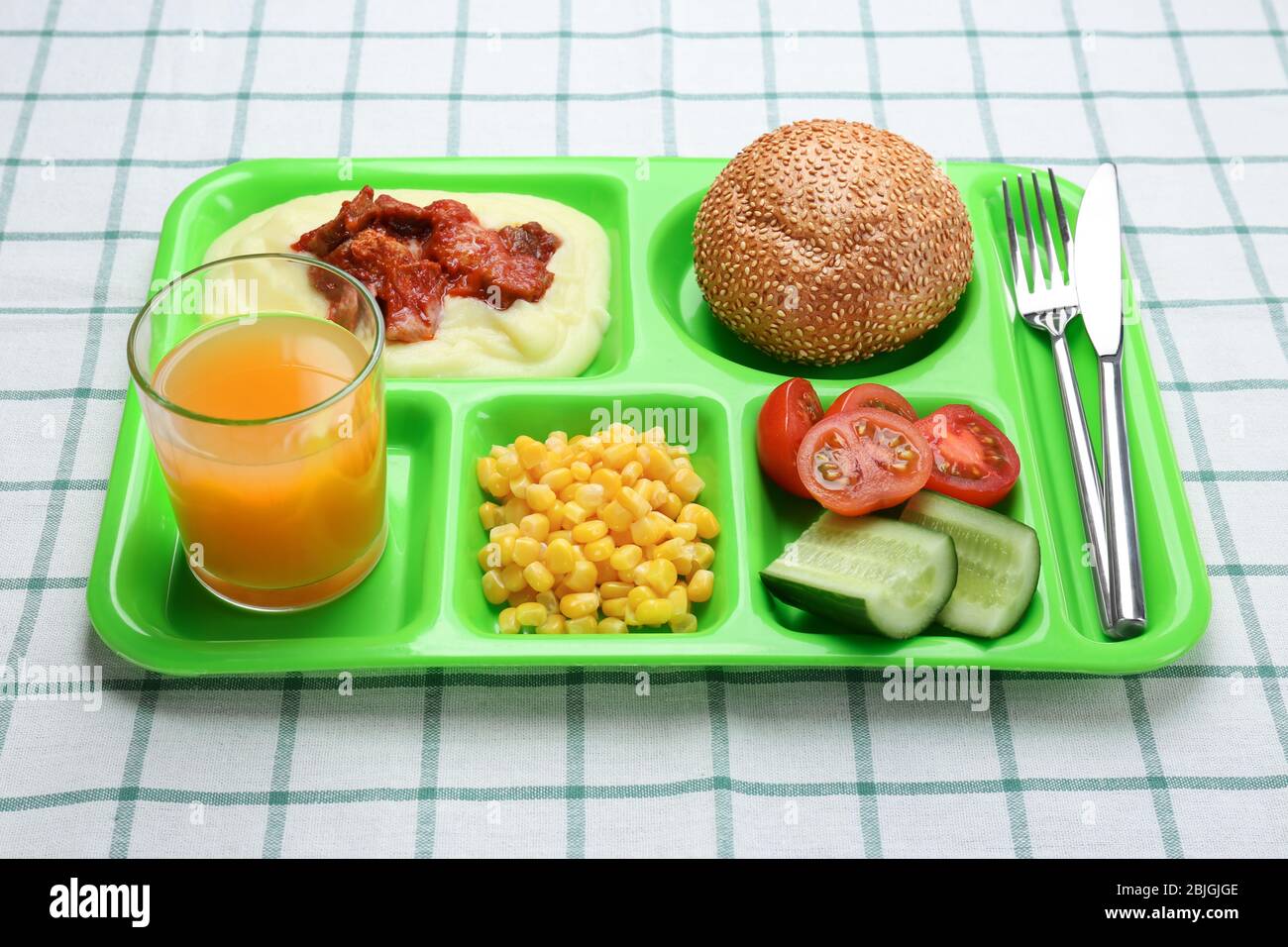 Serving tray with delicious food on tablecloth. Concept of school lunch ...