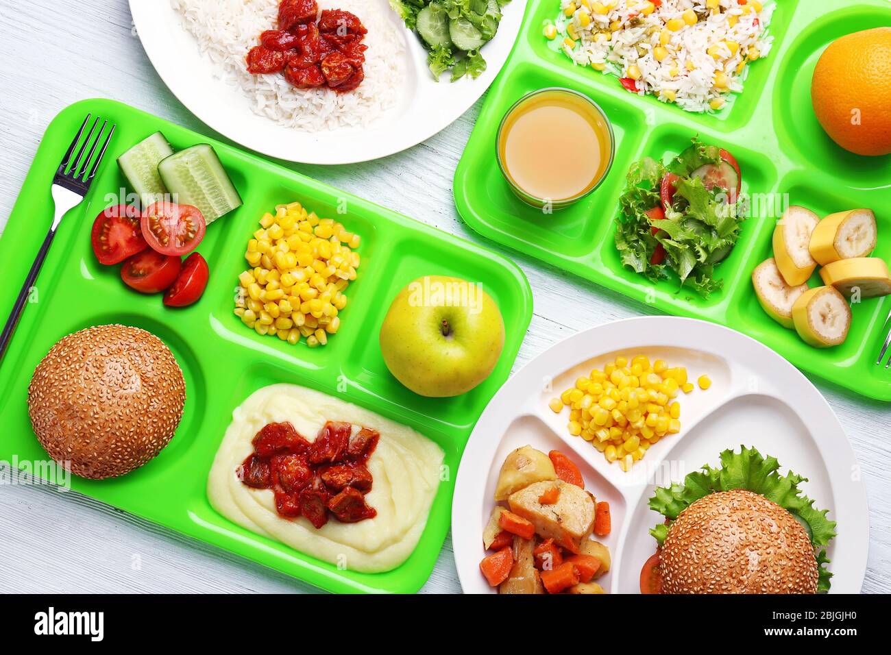 Serving trays with delicious food on table. Concept of school lunch ...