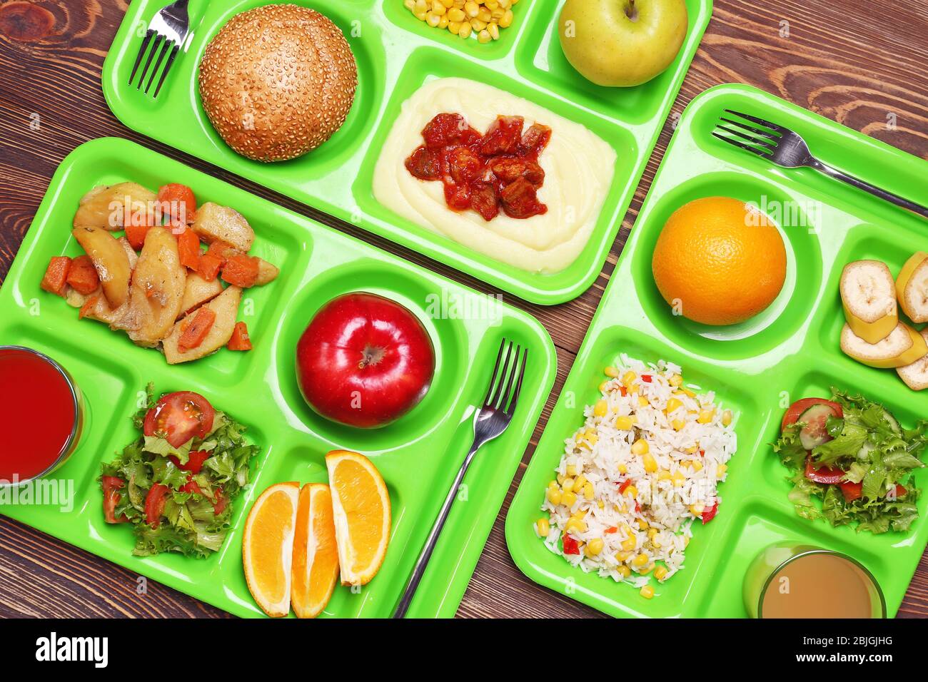 Serving trays with delicious food on table. Concept of school lunch ...