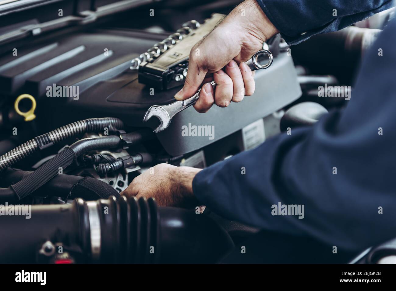 Mechanic Car Service Man is Working in Garage Workshop, Close-Up of ...