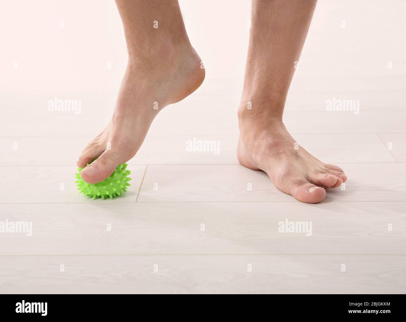 Feet of man doing exercises with stress ball in clinic Stock Photo - Alamy