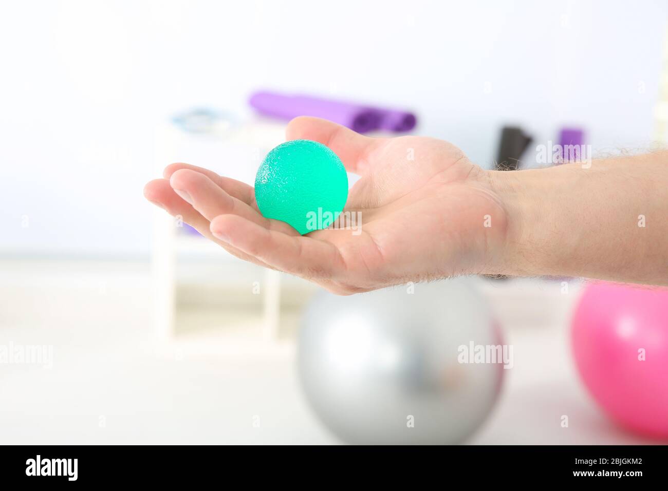 Male hand with stress ball in clinic Stock Photo - Alamy