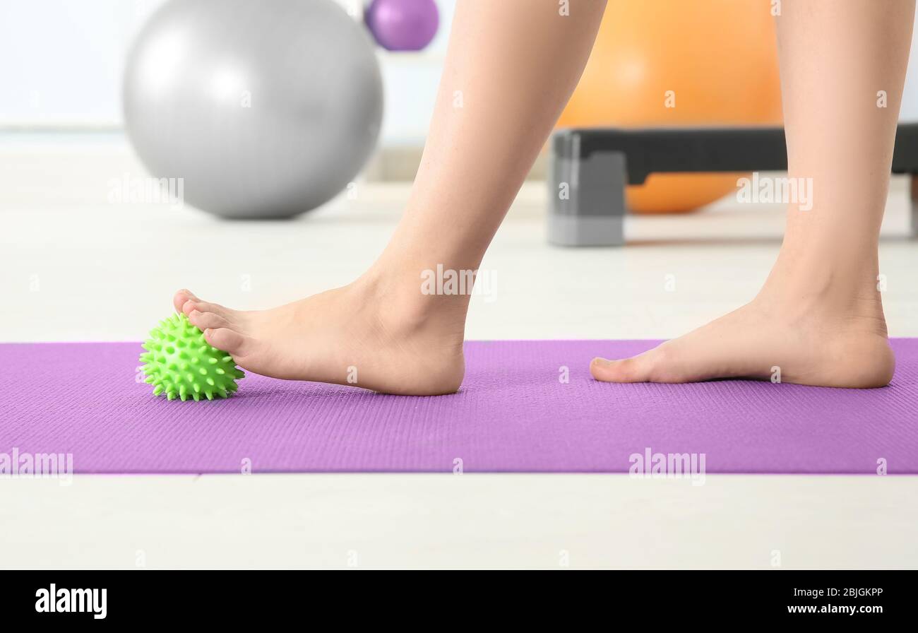 Feet of woman doing exercises with stress ball in clinic Stock Photo ...