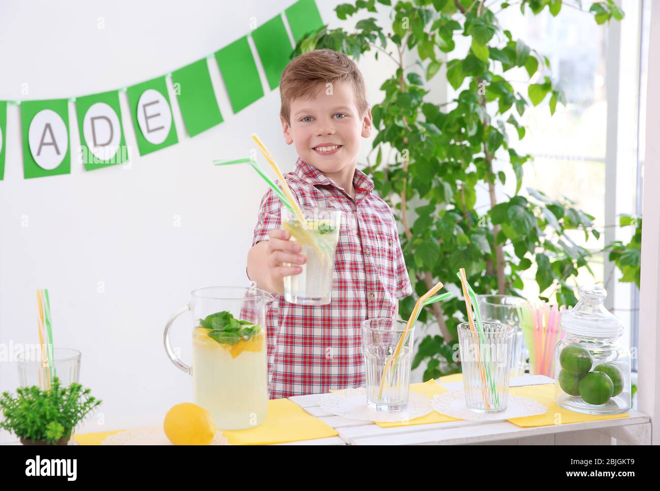 Cute little boy selling lemonade at counter Stock Photo - Alamy