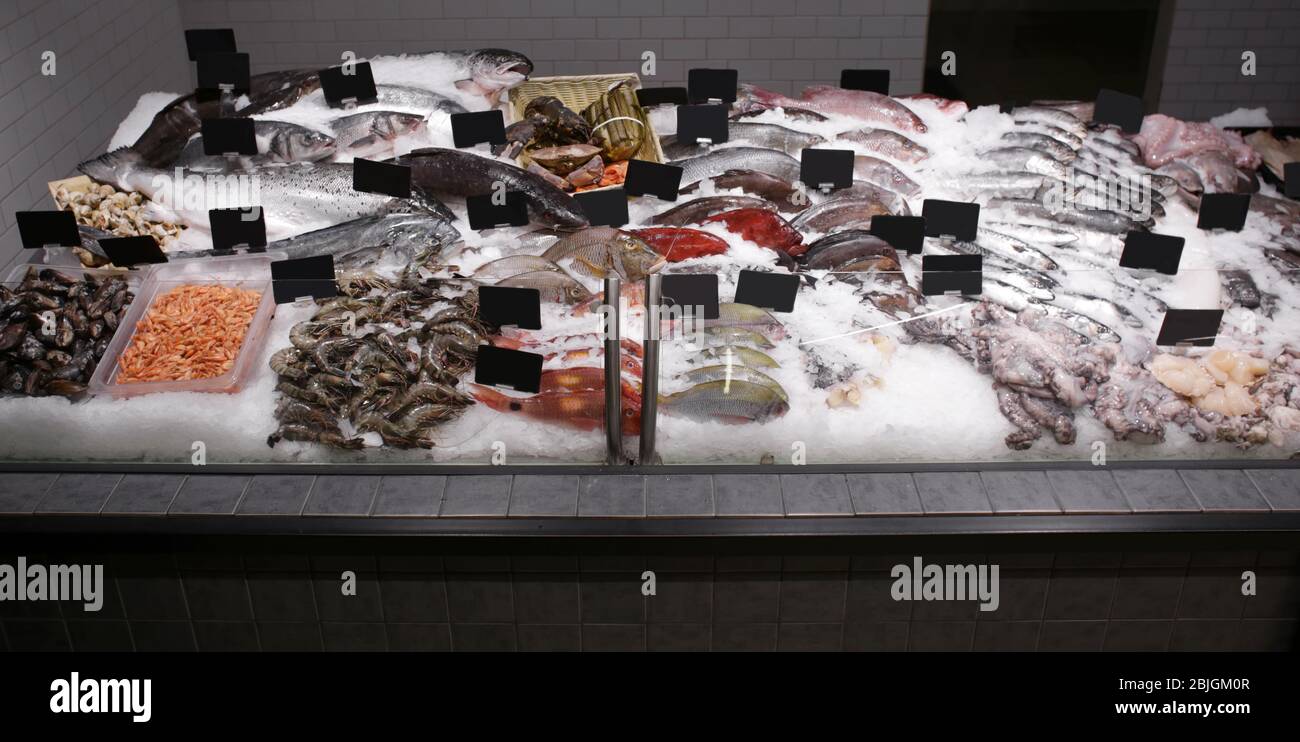 Fresh fish and other seafood in supermarket Stock Photo - Alamy