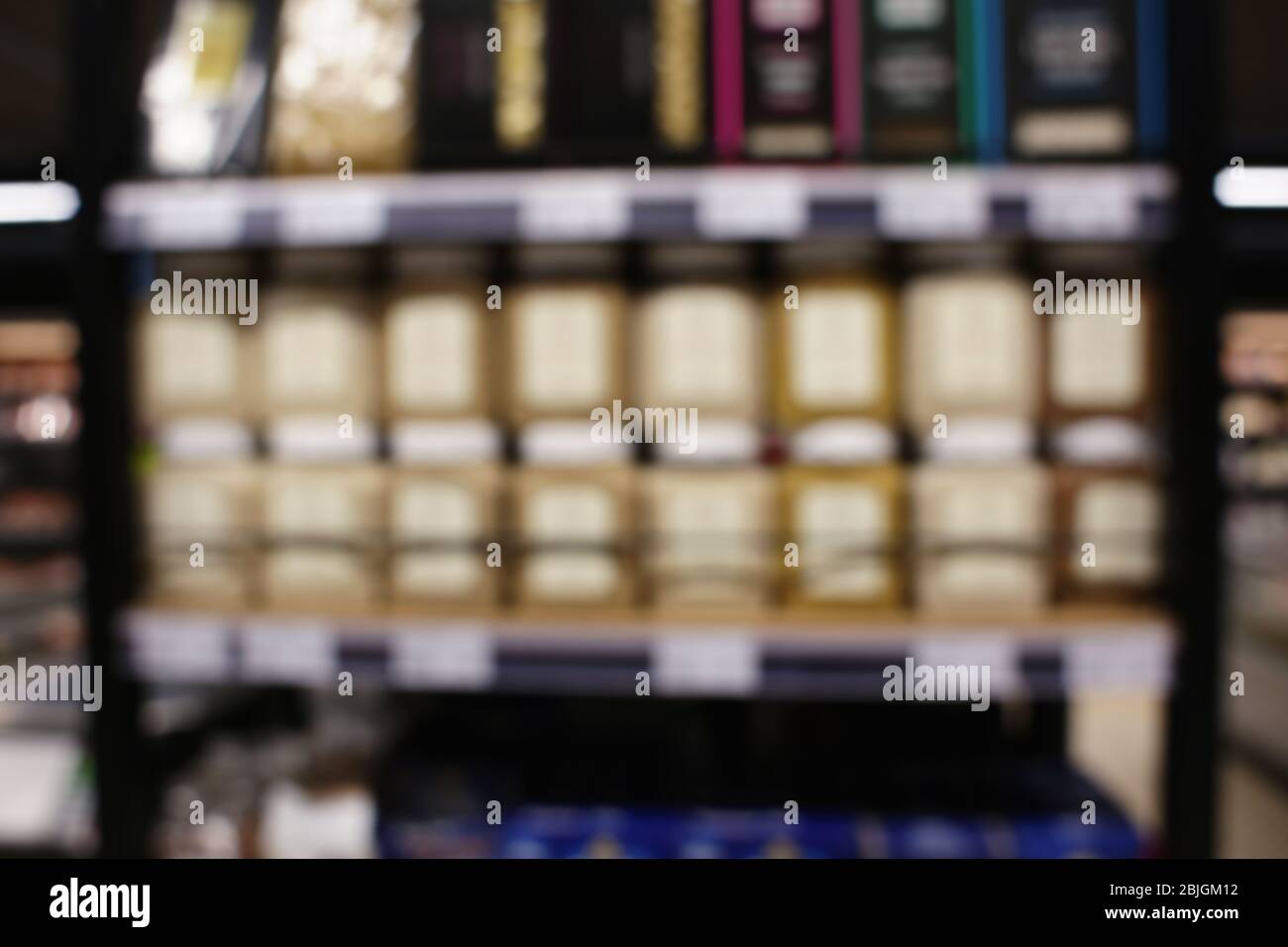 Blurred view of supermarket shelves with different rice Stock Photo - Alamy