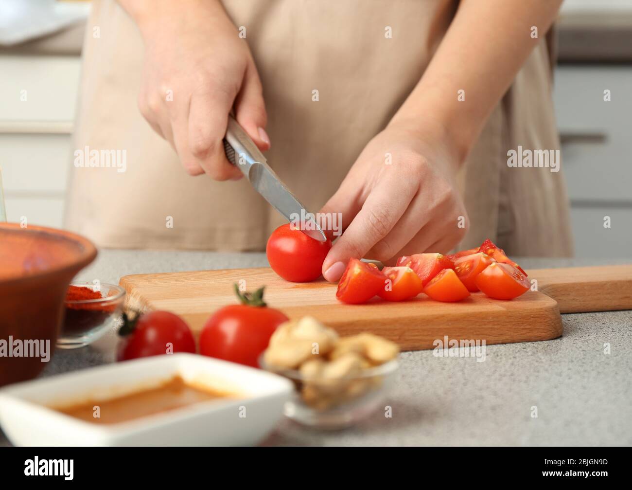 Woman cooking in kitchen Stock Photo - Alamy