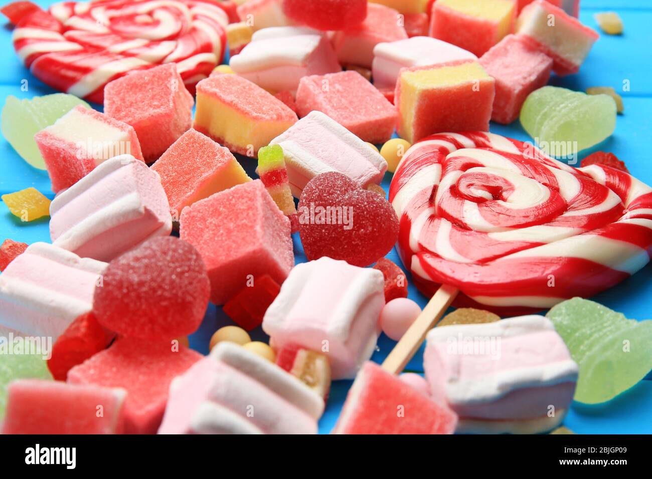 Composition of delicious candies, closeup Stock Photo - Alamy
