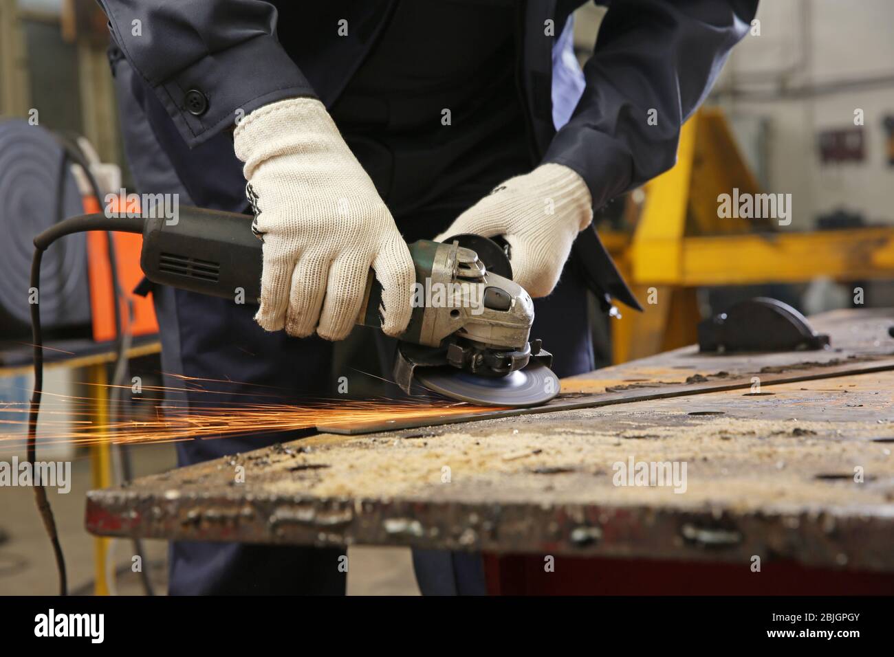 Male hands angle grinder cutting hi-res stock photography and images ...
