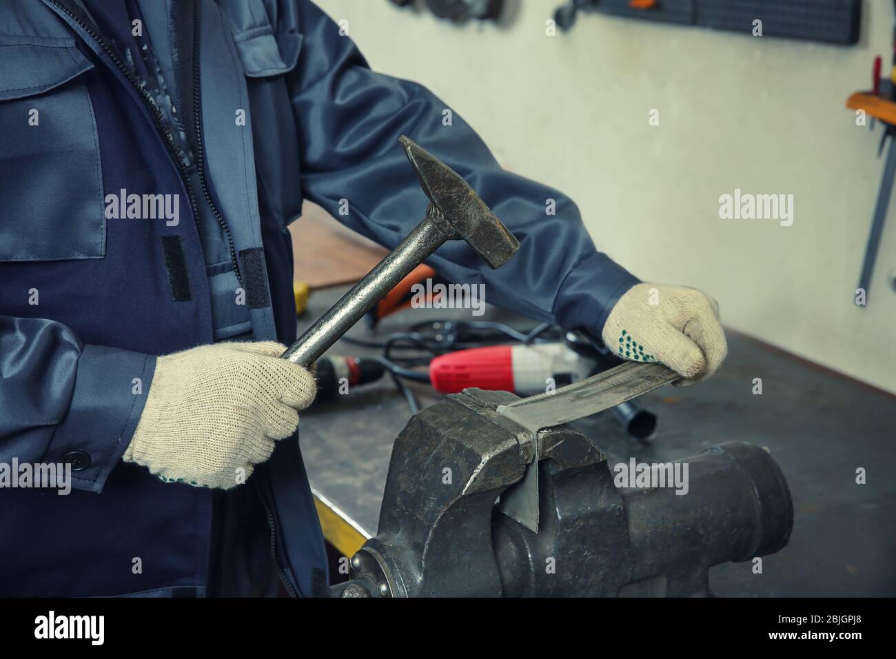 Man using grip hammer hi-res stock photography and images - Alamy