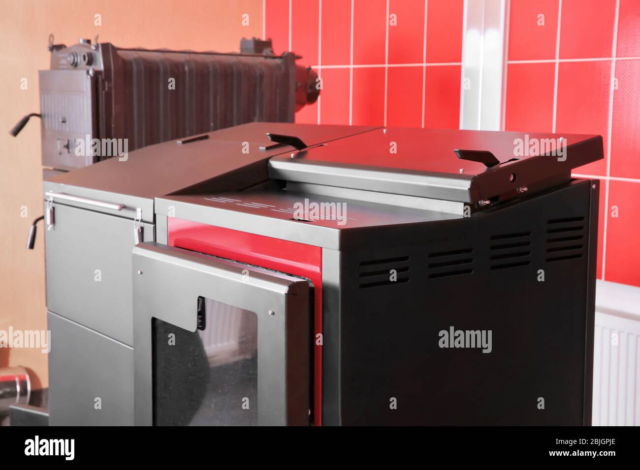 Solid fuel boiler indoors. Energy savings concept Stock Photo - Alamy