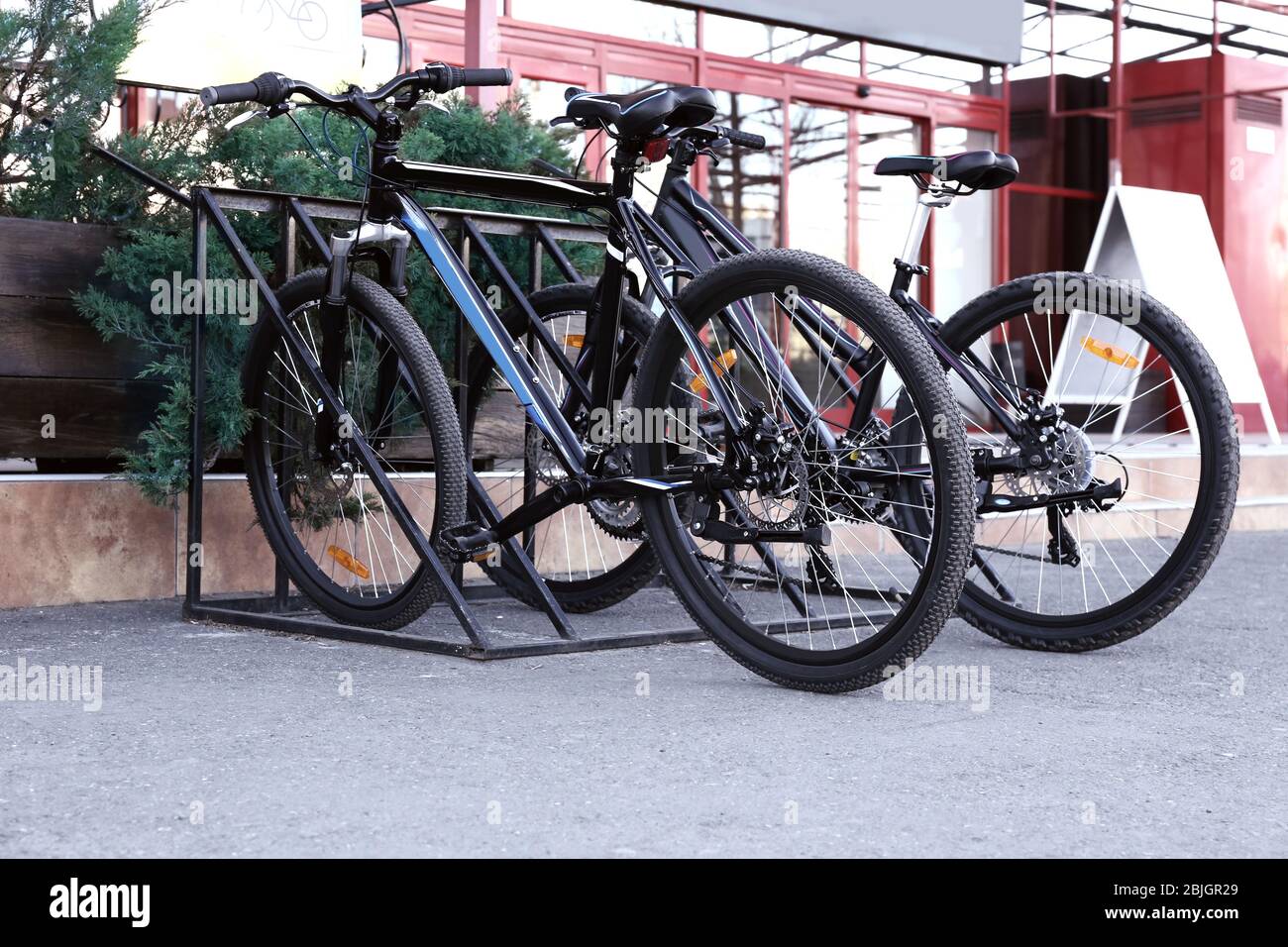 Bicycles in parking lots outdoors Stock Photo - Alamy