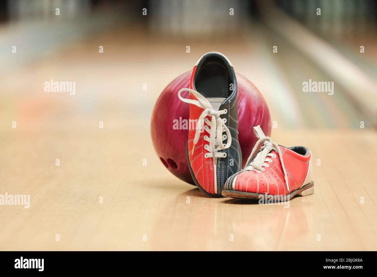 Ball and shoes on floor in bowling club Stock Photo - Alamy