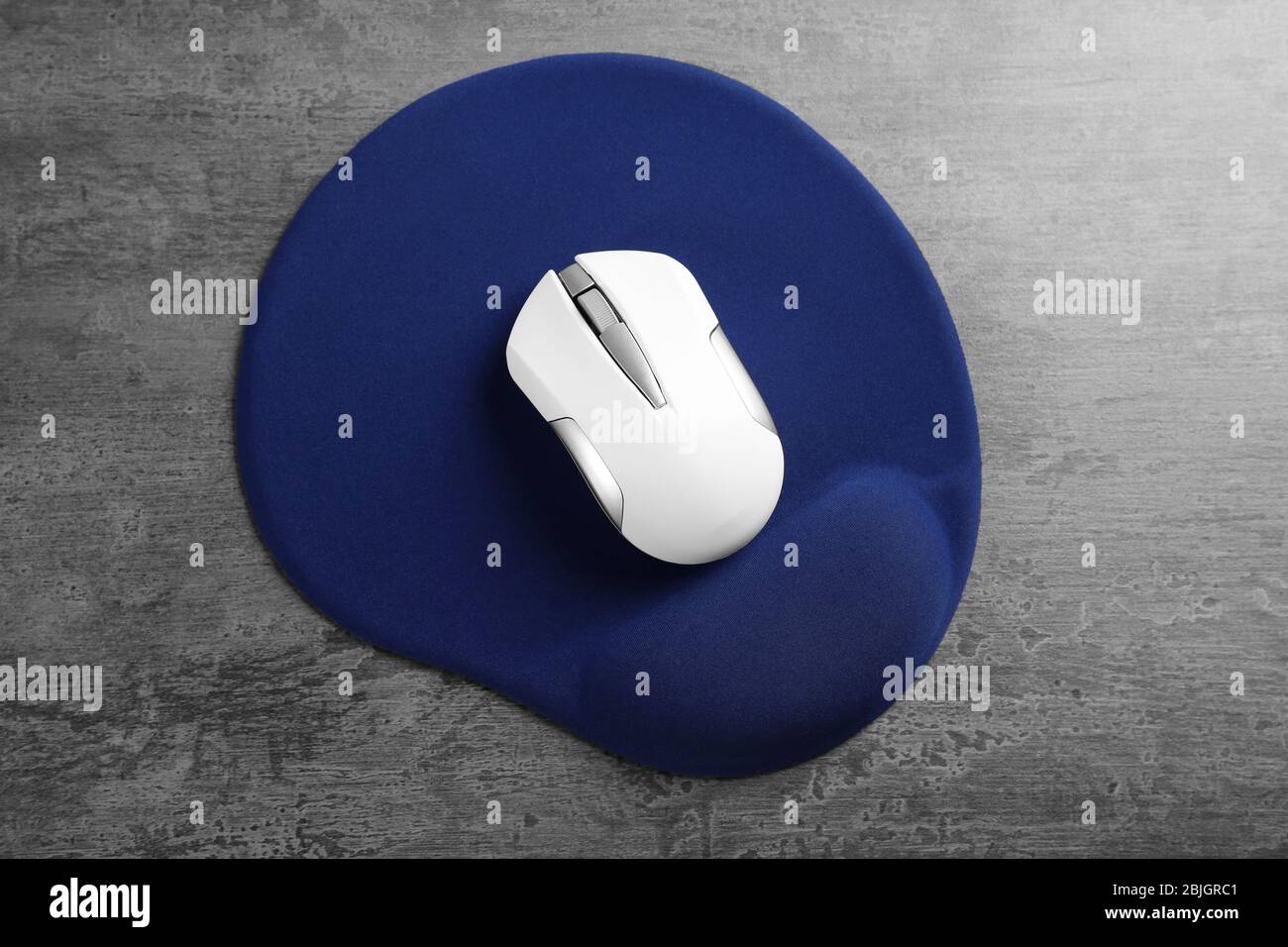 Blank mat and wireless mouse on textured background Stock Photo - Alamy