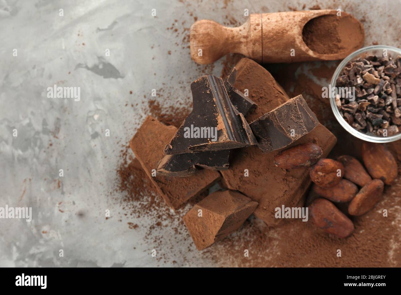 Composition of cocoa products on table Stock Photo - Alamy