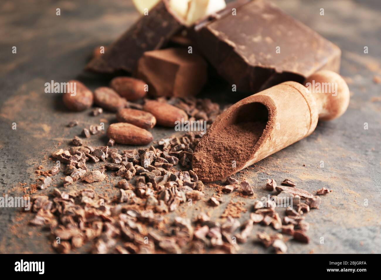 Composition of cocoa products on table Stock Photo - Alamy