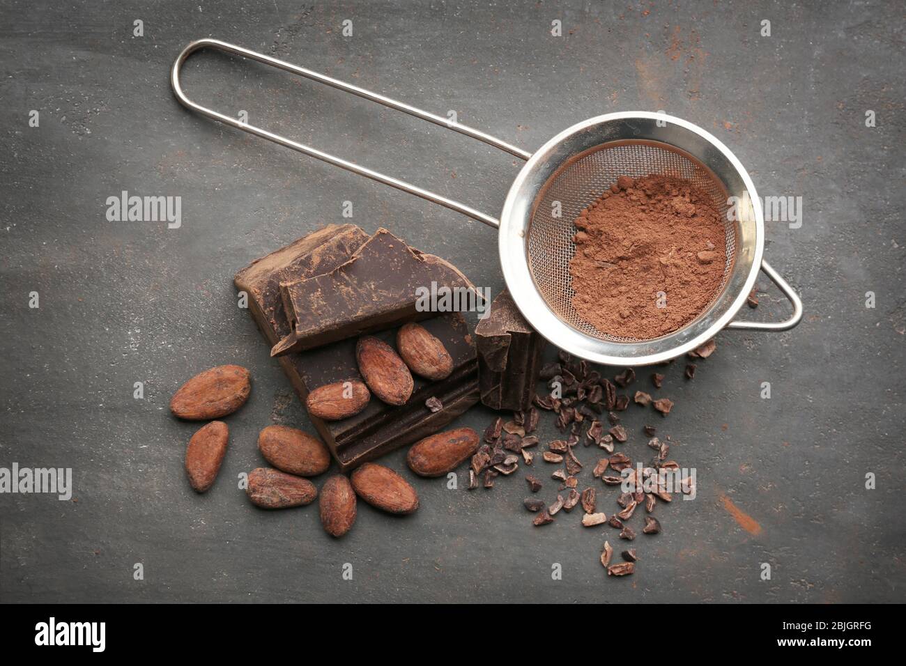 Composition of cocoa products on table Stock Photo - Alamy