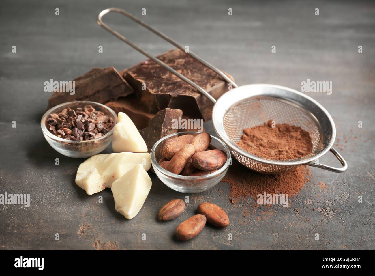 Composition of cocoa products on table Stock Photo - Alamy