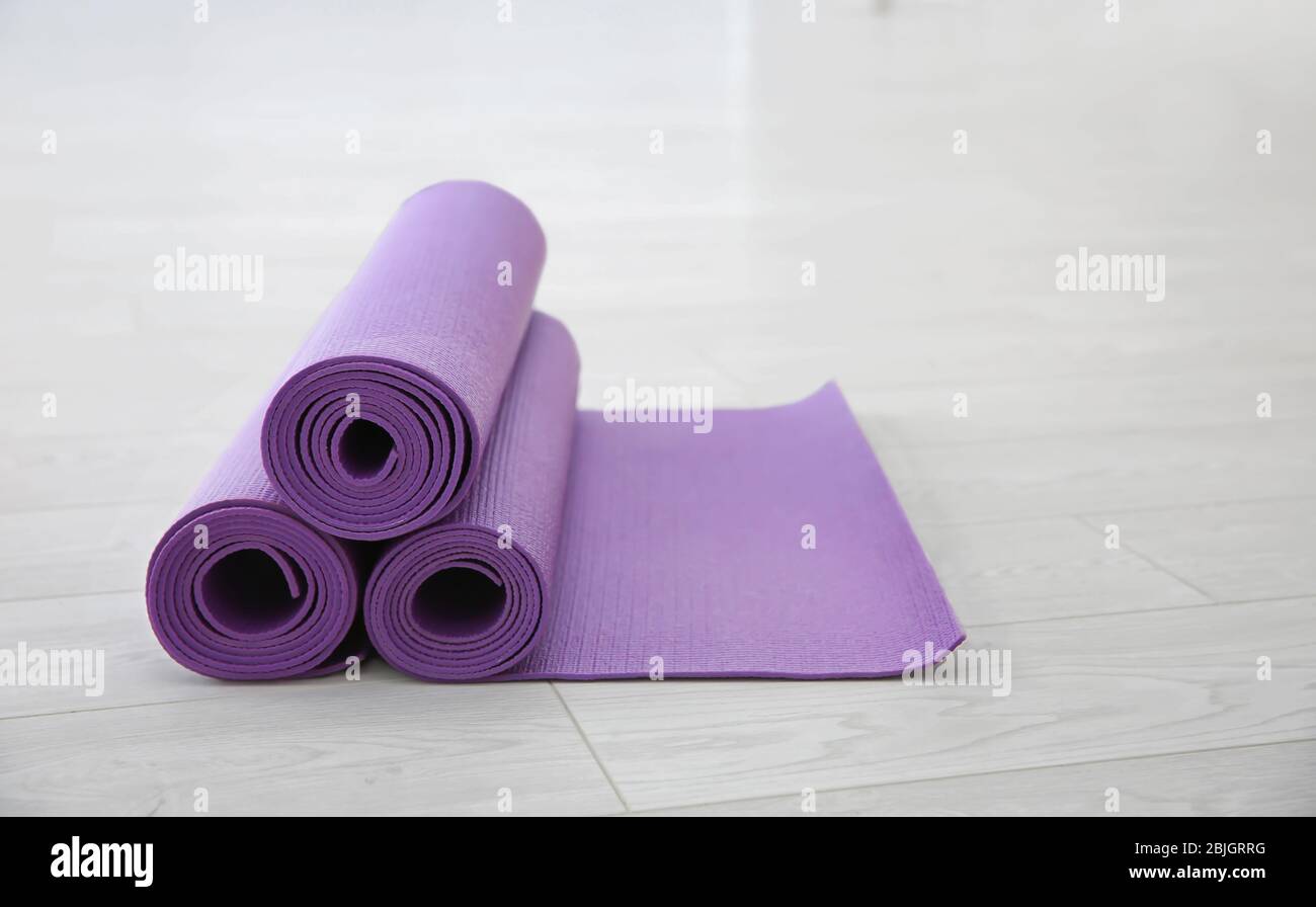 Practicing yoga on mats three hi-res stock photography and images - Alamy
