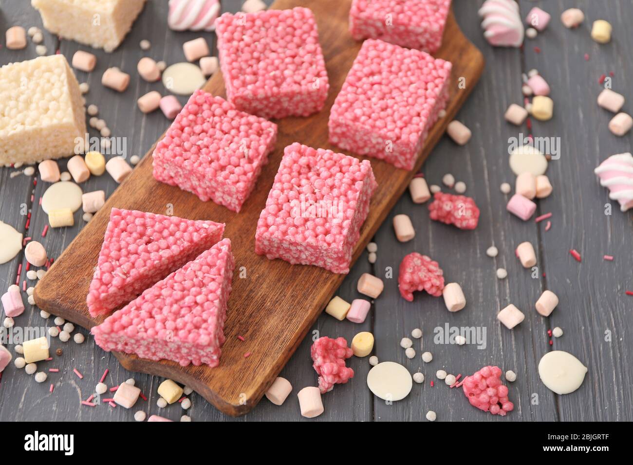 Pink crispy dessert on wooden background Stock Photo - Alamy
