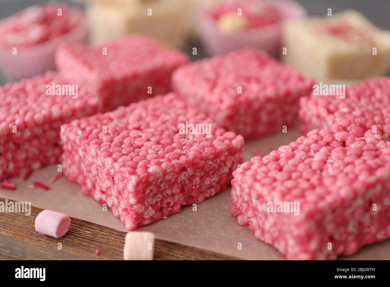 Pink crispy dessert on wooden background Stock Photo - Alamy