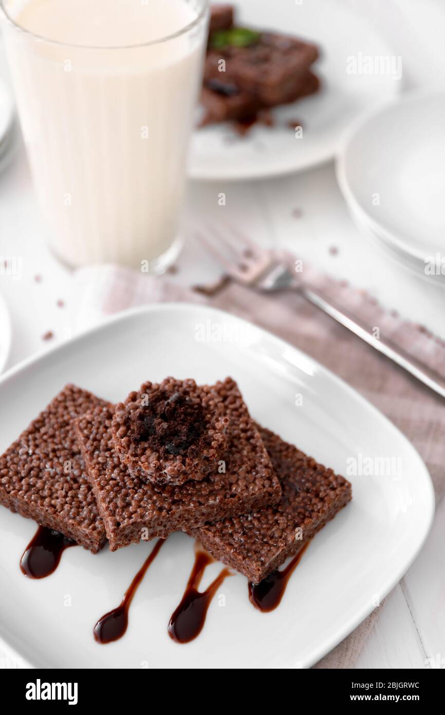 Chocolate crispy dessert on white plate Stock Photo - Alamy