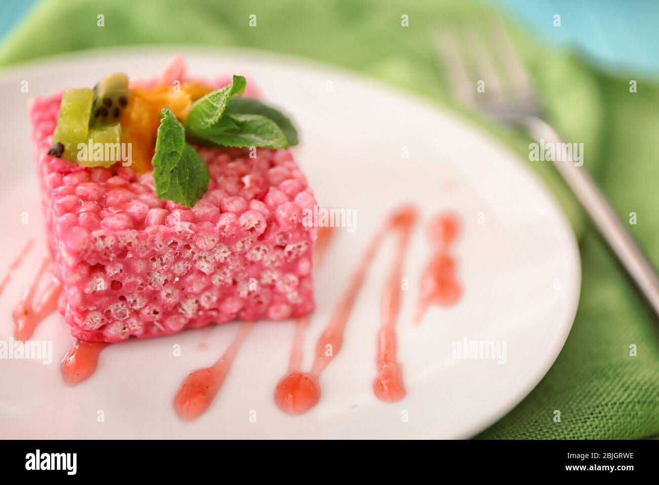 Pink crispy dessert with fruits and mint leaf Stock Photo - Alamy