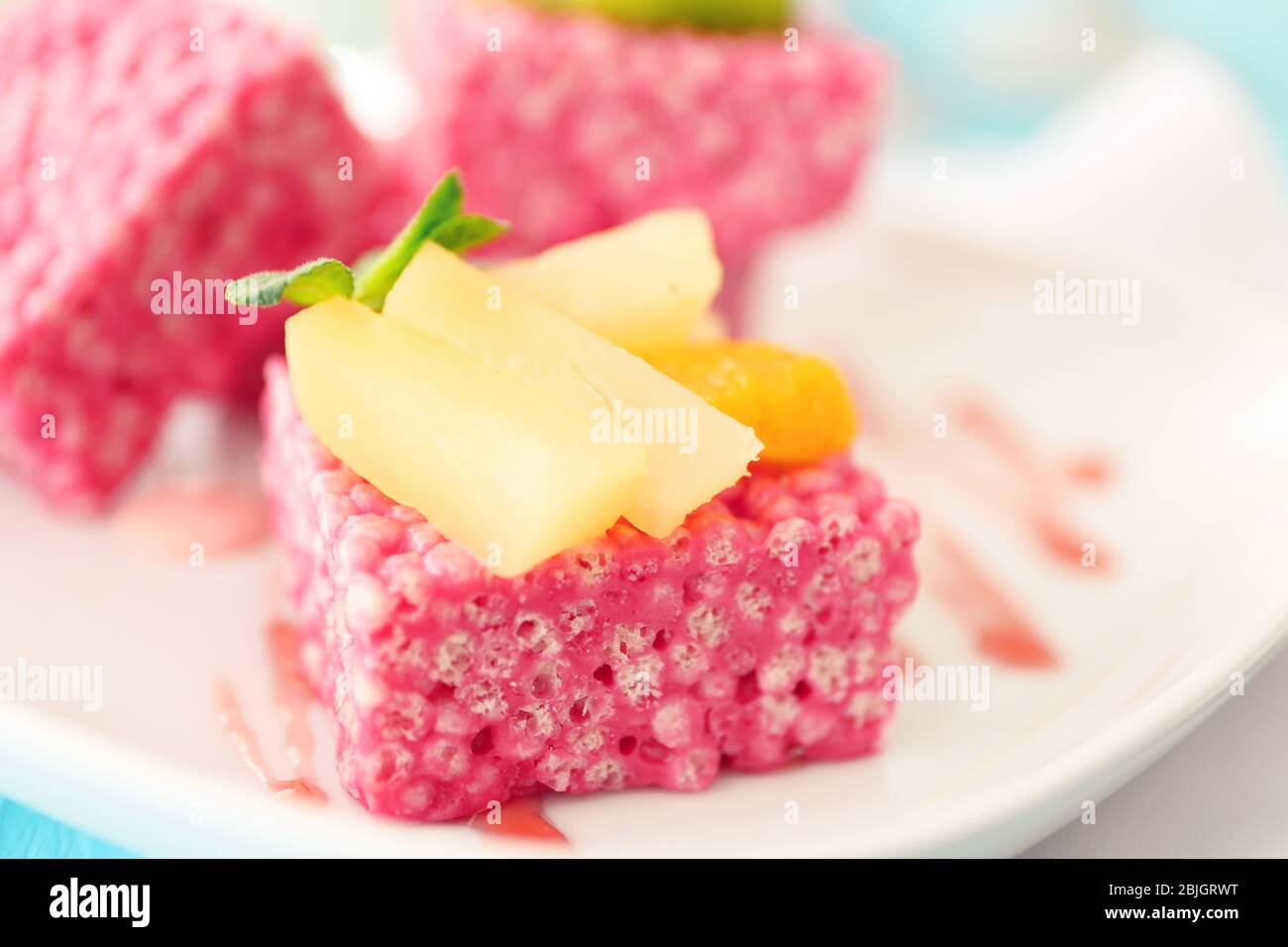 Pink crispy dessert with fruits and mint leaf Stock Photo - Alamy