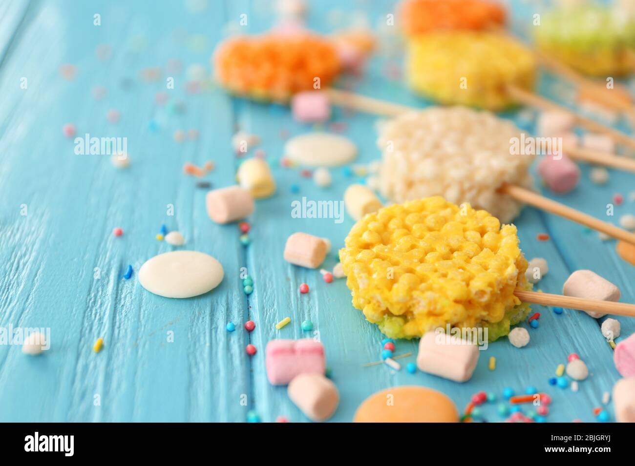 Round shaped crispy dessert on blue background Stock Photo - Alamy