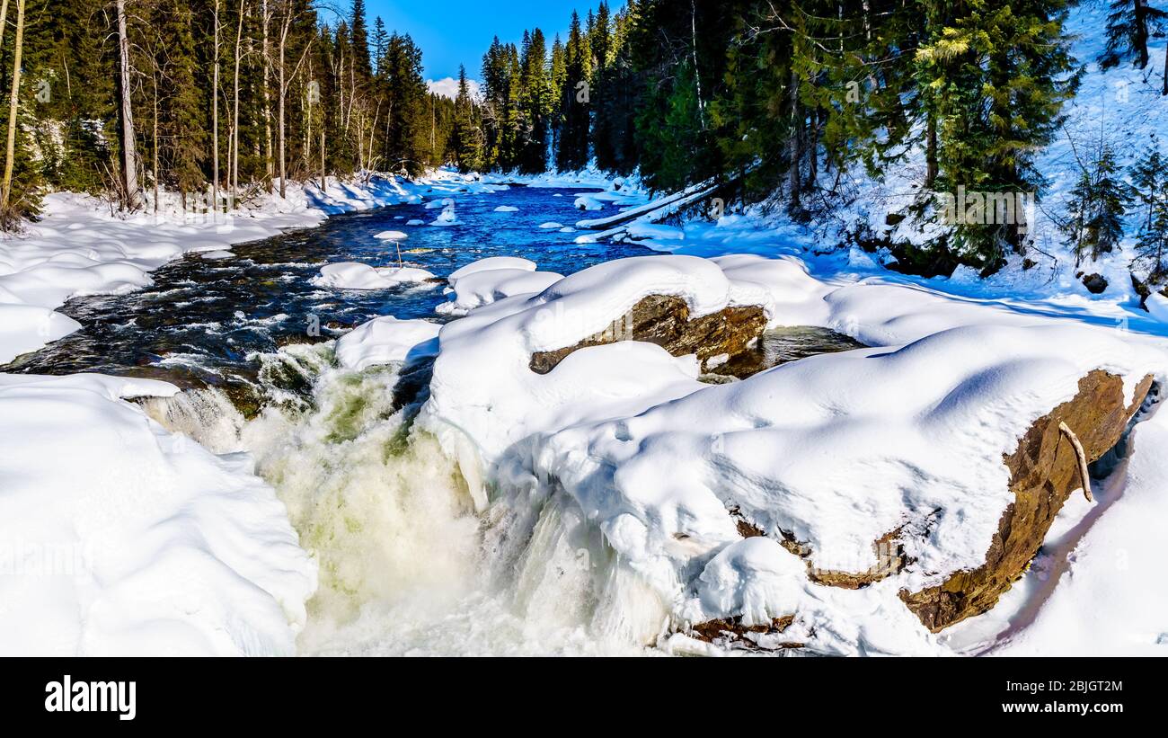 Water of the Murtle River tumbles over the edge of the partly frozen ...